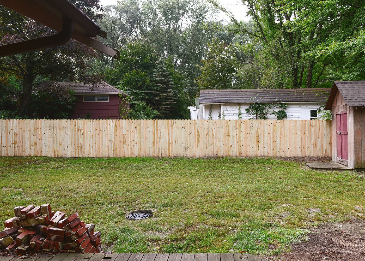 Staining Our Fence Black! - Yellow Brick Home